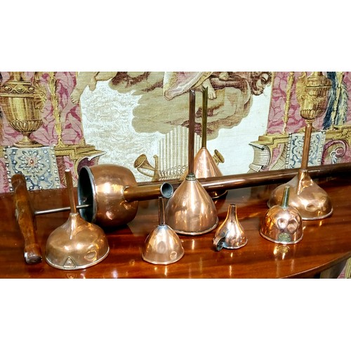 A copper rum pump, rolled rim, turned handle, 103cm high, marked 53598 ...