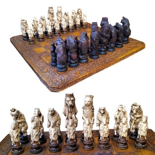 An oversized Reynard The Fox pattern resin chess set with chess board ...