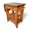 A contemporary kitchen island / butcher's block made by Butler, the ...