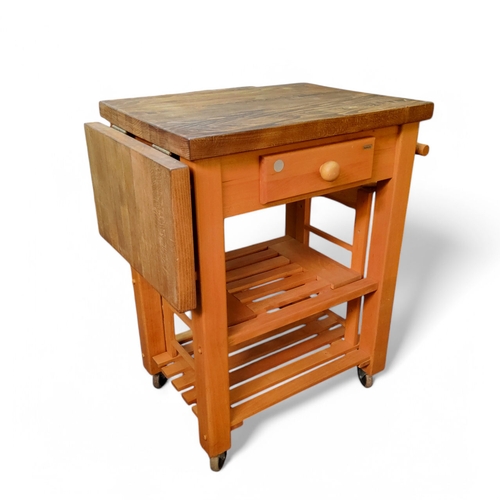 A contemporary kitchen island / butcher's block made by Butler, the ...