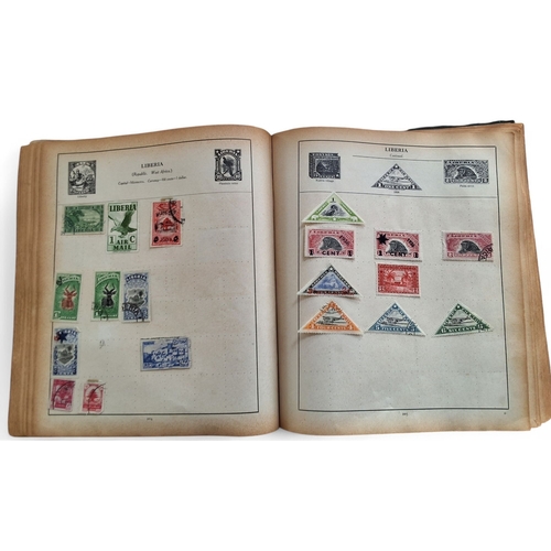 Stamps- A Strand stamp album well filled with a mint and used ...