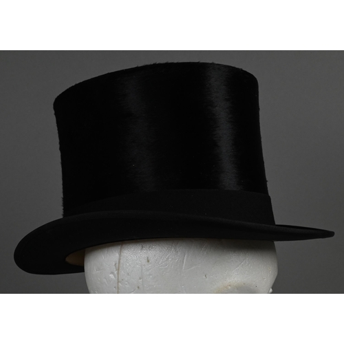 A Christie's of London black silk top hat in original box, stating size ...