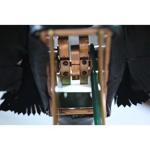 A brass, copper and leather 'Flying Mascot' automaton crow, probably ...