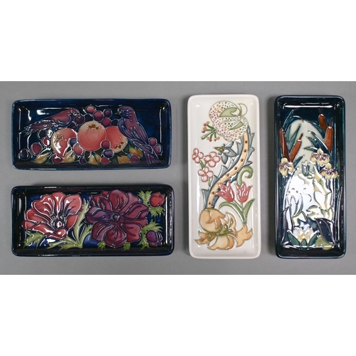 Four unboxed Moorcroft rectangular 20 x 9 cm dishes, to/w two ashtrays ...