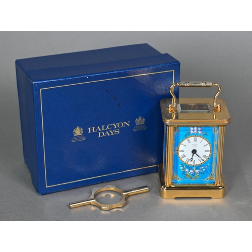 A boxed Halcyon Days carriage clock with blue enamel panels, 10 cm high