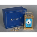 A boxed Halcyon Days carriage clock with blue enamel panels, 10 cm high