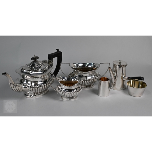 A silver three-piece tea service with half-reeding and composite ...