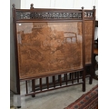 A two panel mahogany framed fret cut screen with glazed panels over ...