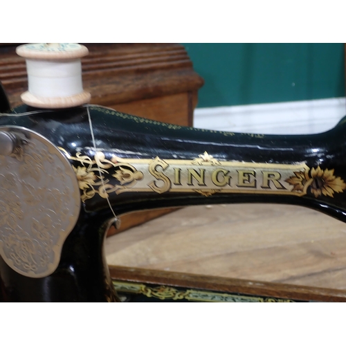 A Singer Sewing Machine No - V1719612 in oak Case.