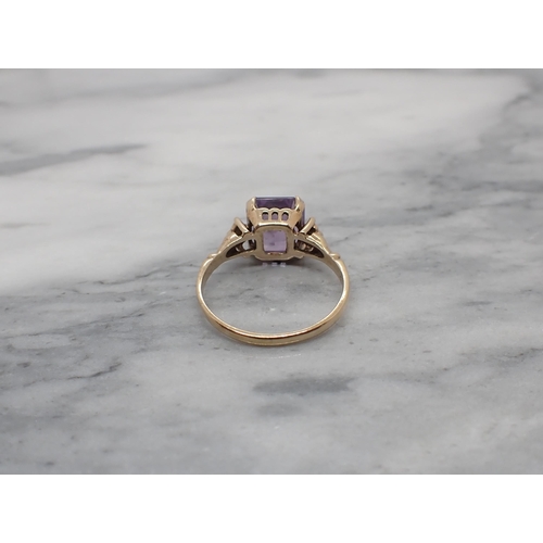 An Amethyst Ring corner claw-set step-cut stone in 9ct gold, ring size ...