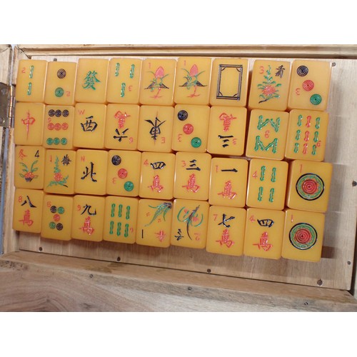 A wooden cased Mahjong Set, four Mahjong Stands, and an Oriental inlaid ...