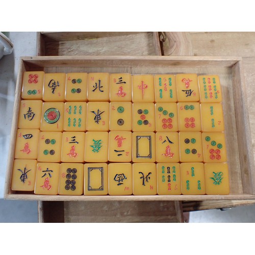 A wooden cased Mahjong Set, four Mahjong Stands, and an Oriental inlaid ...