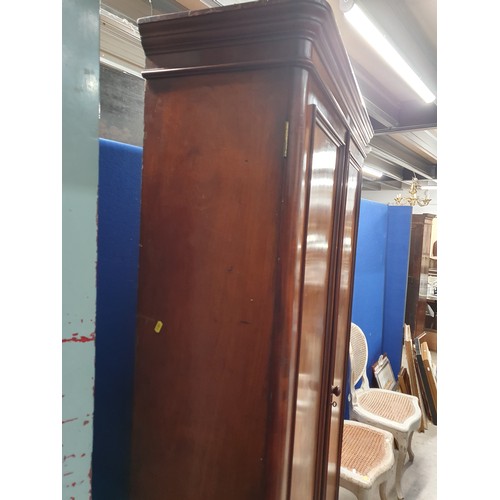 A Victorian mahogany Wardrobe fitted pair of cupboard doors on plinth ...