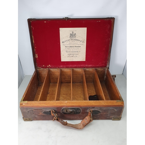 A large leather and brass bound Cartridge Magazine bearing paper trade ...