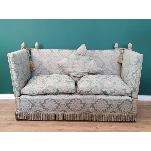 A green upholstered two-seater Knowle Sofa with floral and leafage ...