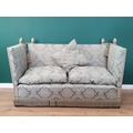 A green upholstered two-seater Knowle Sofa with floral and leafage ...