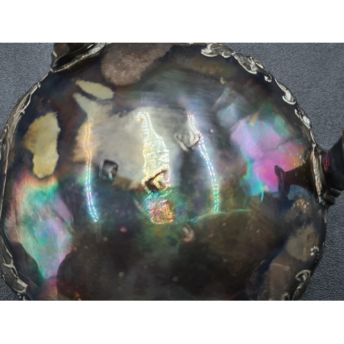 A pair of George III silver Cauldron Salts with floral embossing on ...