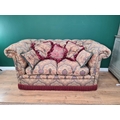 A fine quality reproduction Chesterfield Settee by John Nethercott with ...