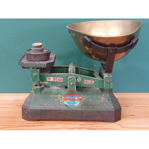 A set of green painted Hayward & Sons Balance Scales with brass bowl ...