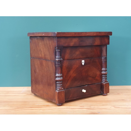 A 19th Century mahogany box in the form of a chest with hinged cover ...