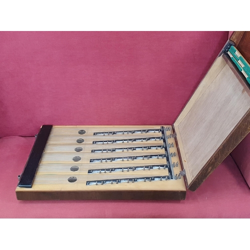 A zither type Harp in folding wooden case, 2ft 4in L, (R10)