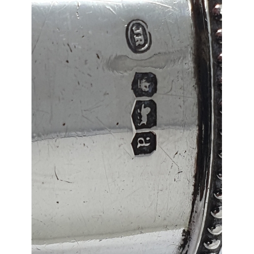 A George V silver circular Napkin Ring, Sheffield 1918, and another ...