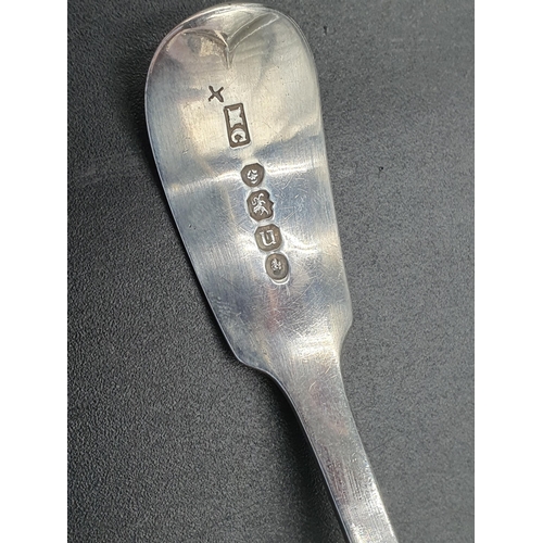 A William IV silver Sifting Ladle fiddle pattern engraved crest and ...