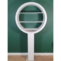A white metal circular Display Stand with three open shelves, raised on ...