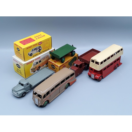 A Dinky Toys No.29C Double Deck Bus, a Luxury Coach, two boxed Atlas ...