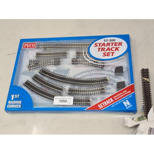 A boxed Peco ST-300 N gauge Starter Track Set and two lengths of Peco ...
