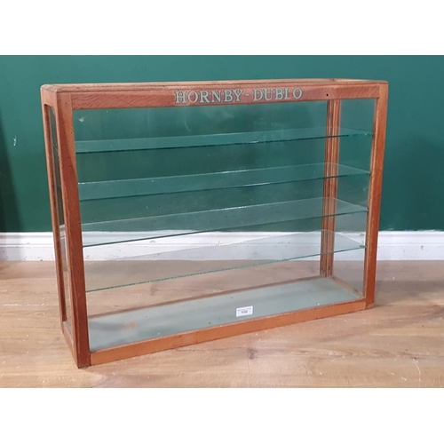 A Hornby Dublo Display Cabinet with shelves and sliding doors to rear ...