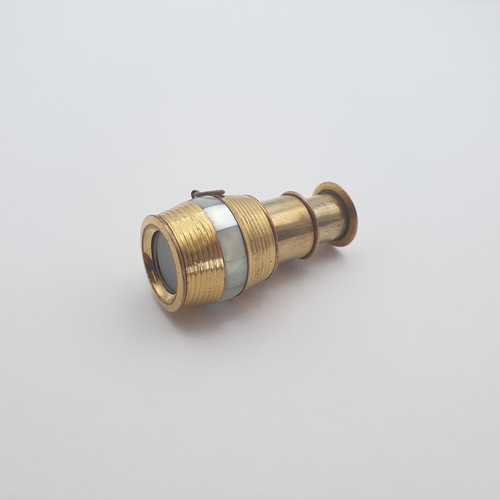 A miniature gilt metal Monoscope with mother of pearl decoration