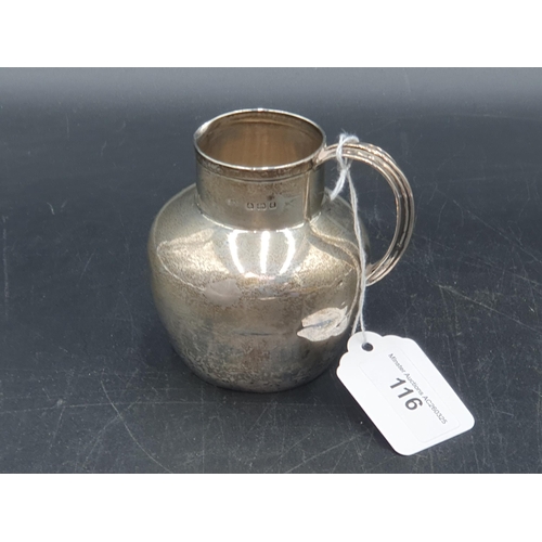 A silver Cream Jug with loop handle, 3 1/4in H, Birmingham 1906, 65gms.