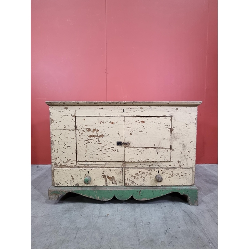 A cream and green painted pine Mule Chest, the lift up lid enclosing ...