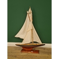 A Model Sailing Boat "Columbia" raised on plinth base, 3ft 3inHigh x ...