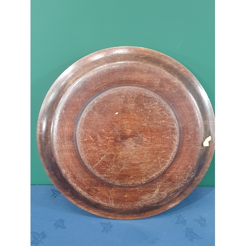 A carved shallow Dish/Bowl with floral decorated rim and four carved ...