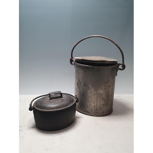 An antique cast iron Cooking Pot 7in W and a Milk Churn 9in H (R6)