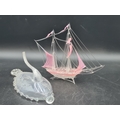 A glass Frigger of two masted boat in pink and clear glass, and a glass ...