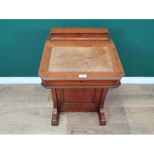 A walnut Davenport with inset gilt tooled lift up writing surface, and ...