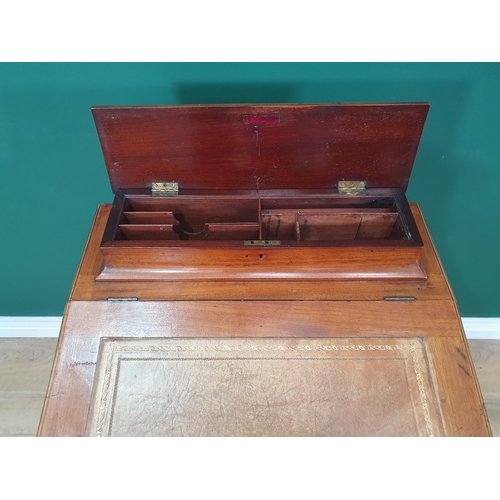 A walnut Davenport with inset gilt tooled lift up writing surface, and ...