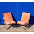 A pair of mid-Century Reyway Chairs, with loose cushions, bearing the ...