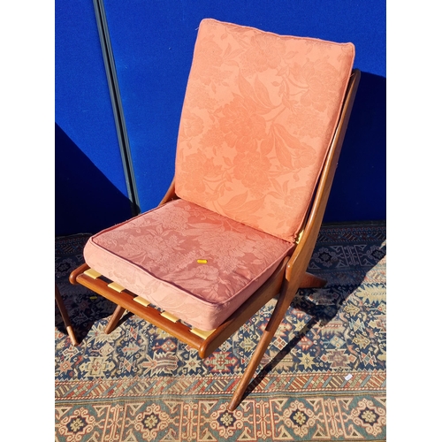 A pair of mid-Century Reyway Chairs, with loose cushions, bearing the ...
