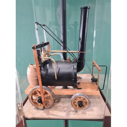 An SOS Talisman Display Stand containing a model of a steam engine, 6ft ...
