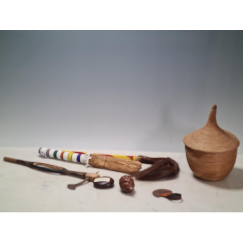 Two African Tools, a beaded Brush, a beaded Fly Whip, a Rwandan Basket ...