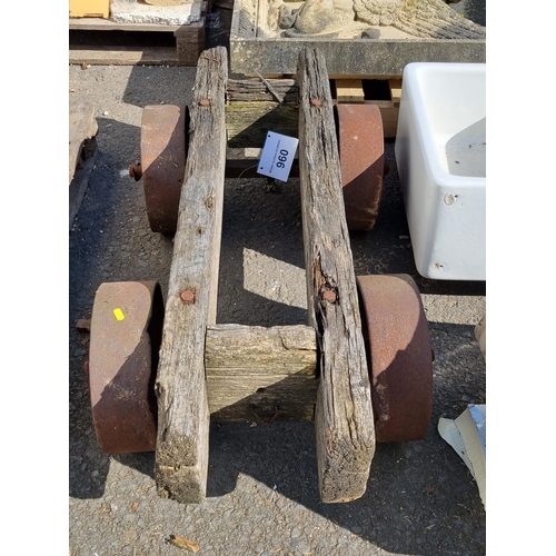A wooden and cast iron Chassis (possibly a Canon base), 4ft Long.