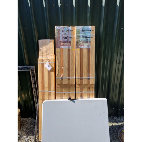 Two flat pack Shelf slatted Storage Units and a grey Folding Table.