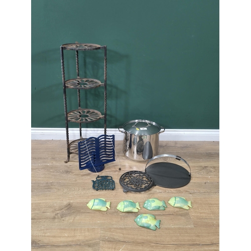 A Meyer Cooking Pot and Cover, a four tier Saucepan Stand, two metal ...