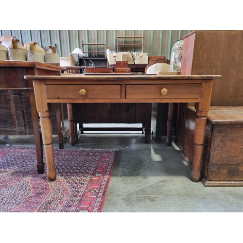 A mixed woods Kitchen Table with pair of frieze drawers raised on ...