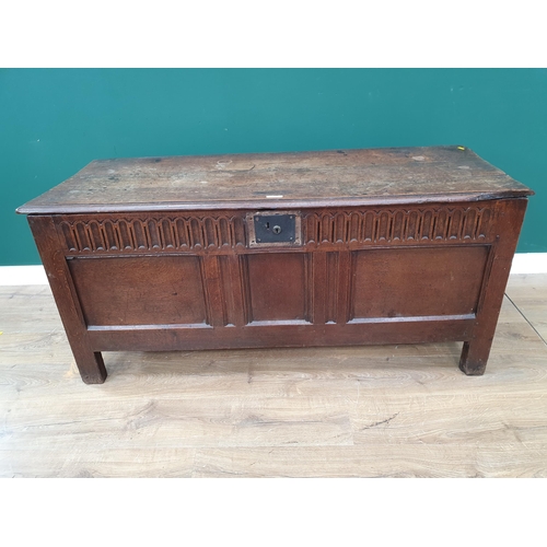 A 17th Century oak Coffer with gouge carved frieze and panelled front ...