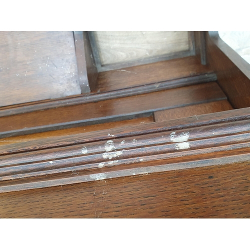 An Elgar & Co. oak cased Organ with pierced fret carving, 4ft W (R6)